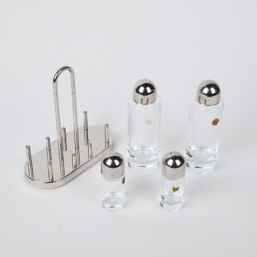 An Alessi Four Piece Condiment Set by Ettore Sottsass