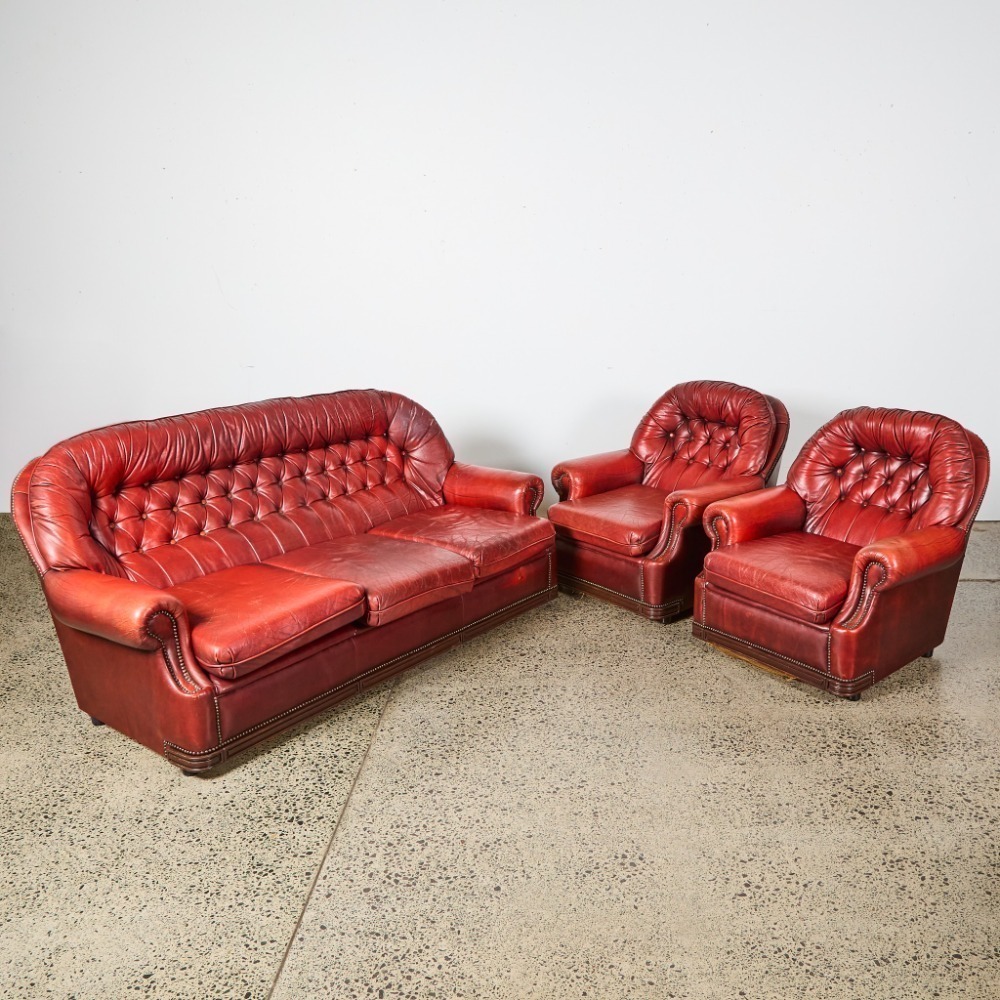 A Vintage Three Piece English Red Leather Suite