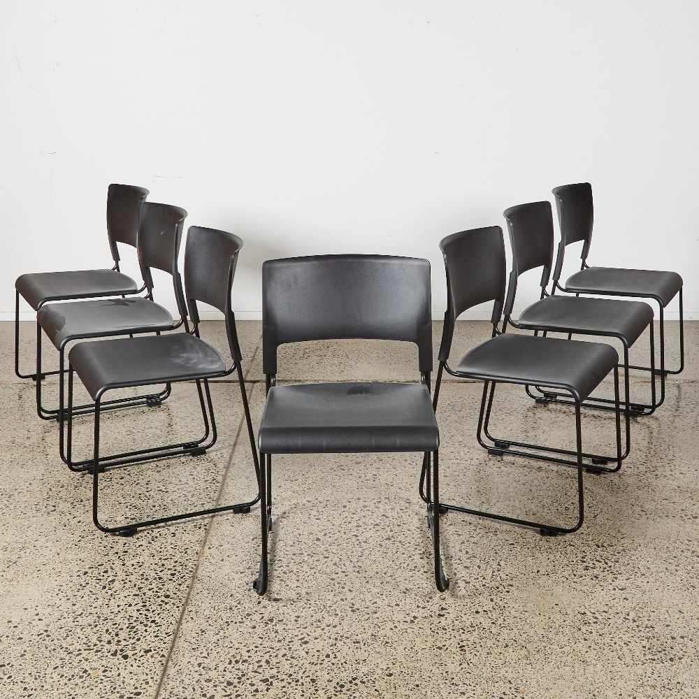 A Set of Six Plastic and Metal Stackable Chairs
