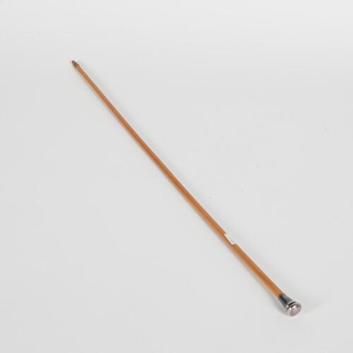 A Cane Baton With Silver Caps and Tips
