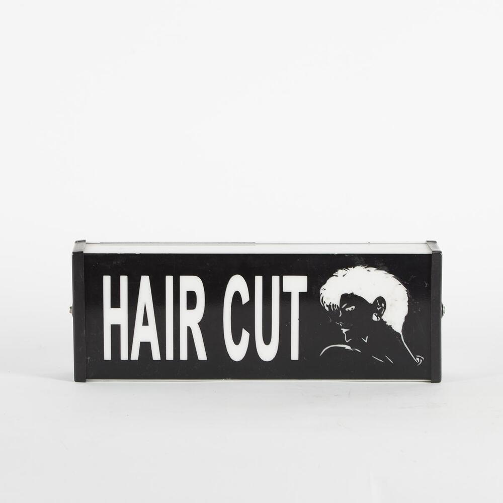 A Vintage Hair Cut Sign Circa 1990s