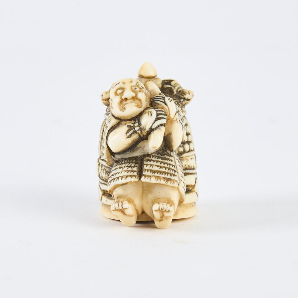 A 19th Century Carved Ivory Netsuke Of Benkei