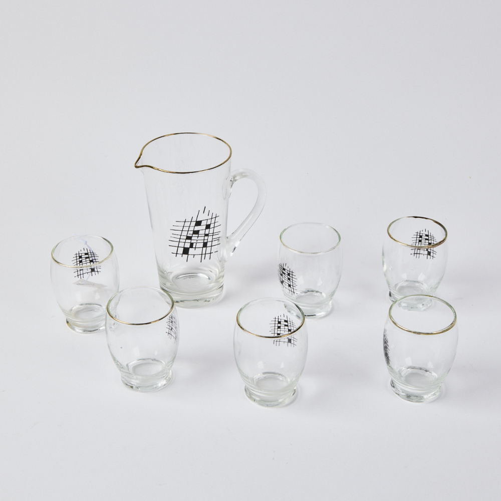 A Mid Century Atomic Pitcher Set with Five Glasses