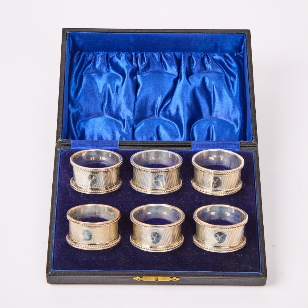 A Set of Six Boxed Sterling Silver Napkin Rings