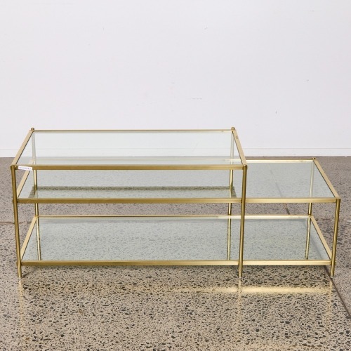 A Contemporary Three Tread Glass Topped Coffee Table