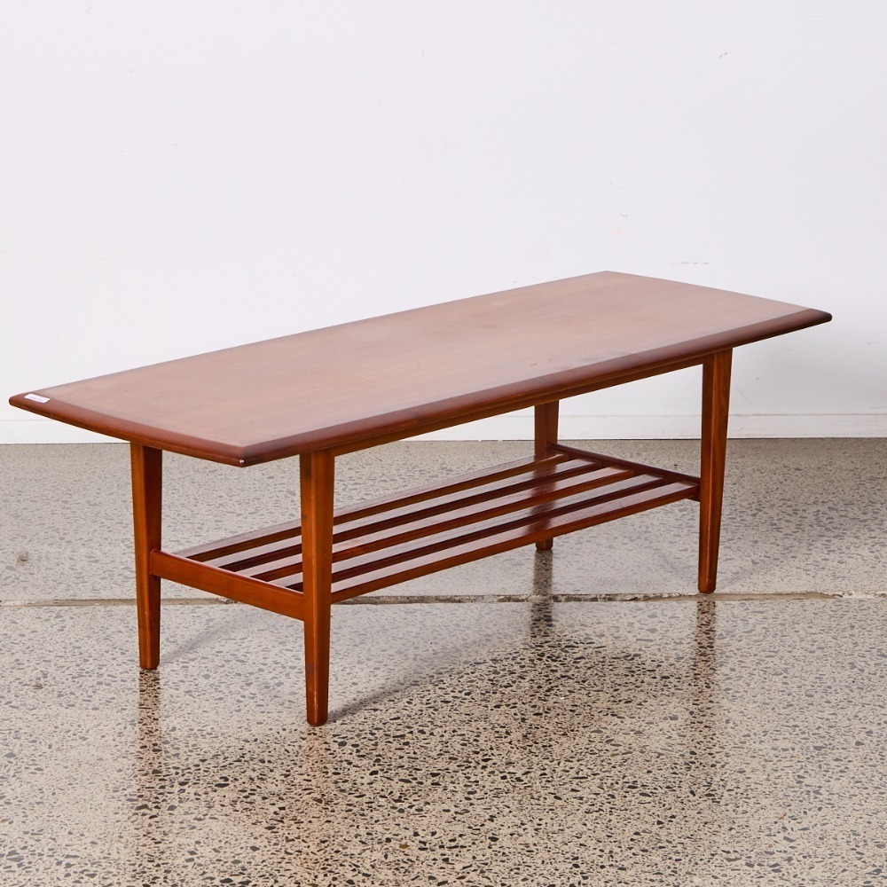 A Jon Jansen Coffee Table With Magazine Rack