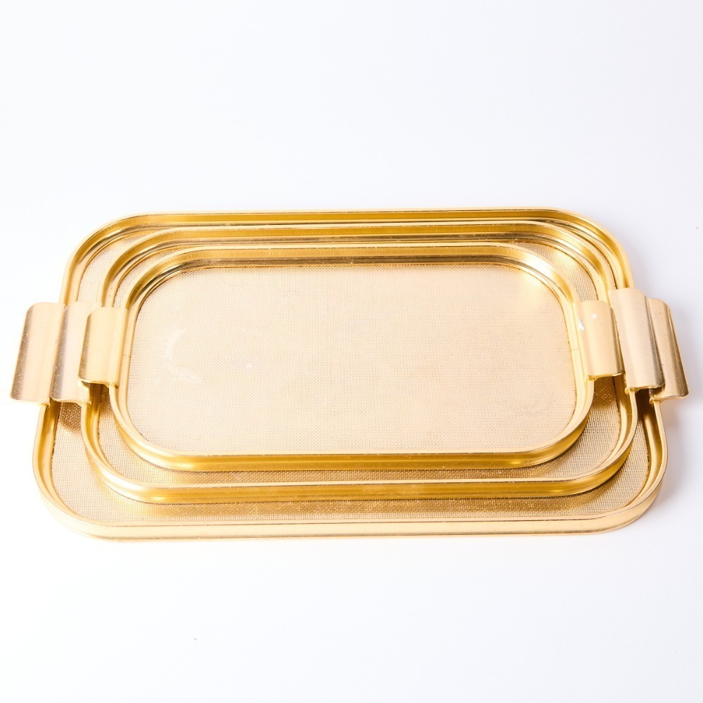 A Trio of Gold Coloured Trays