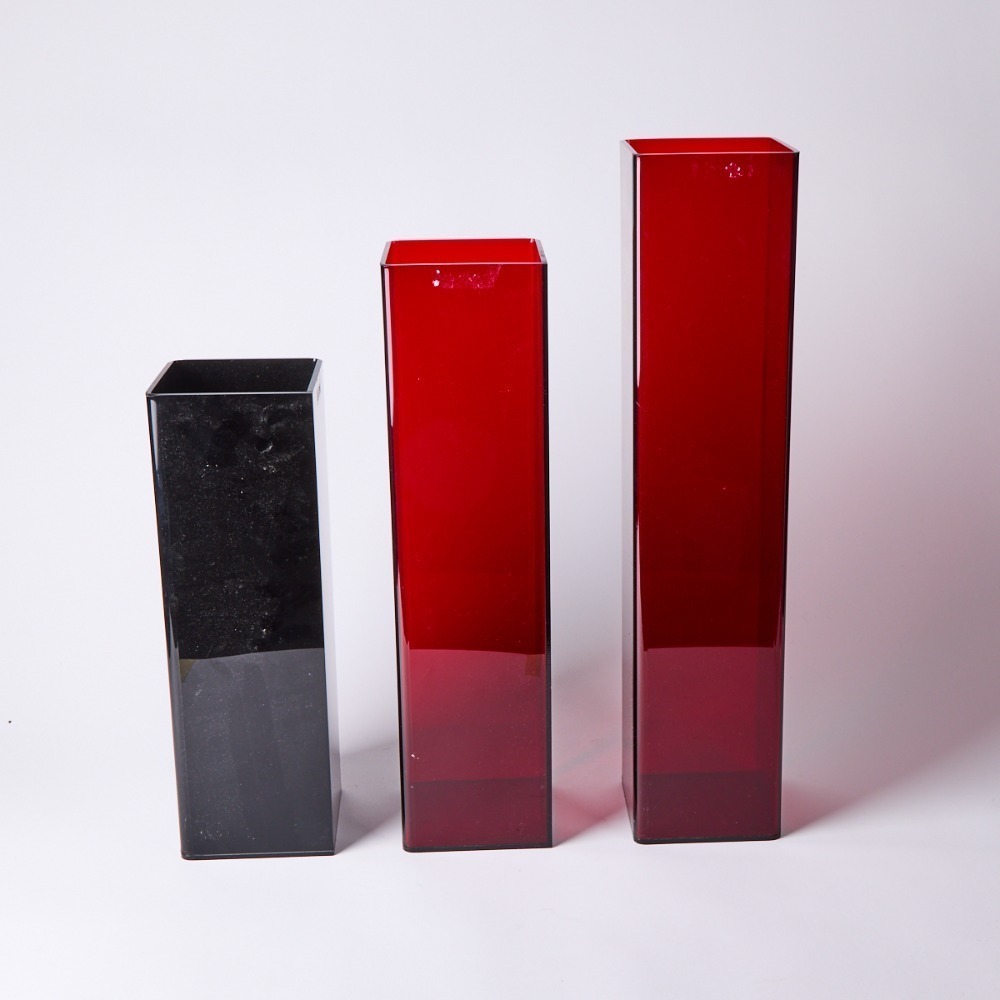 Three Graduated Perspex Vases