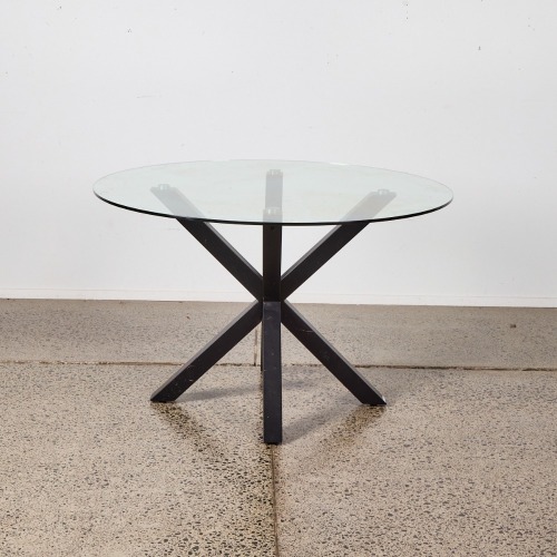 A Circular Glass Topped Table