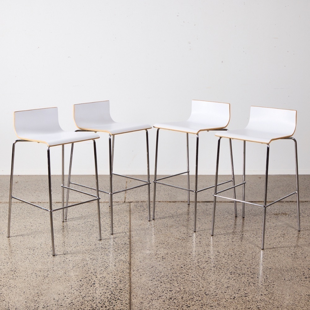 A Suite of Four Minimal Bar Stools With Stainless Steel Base
