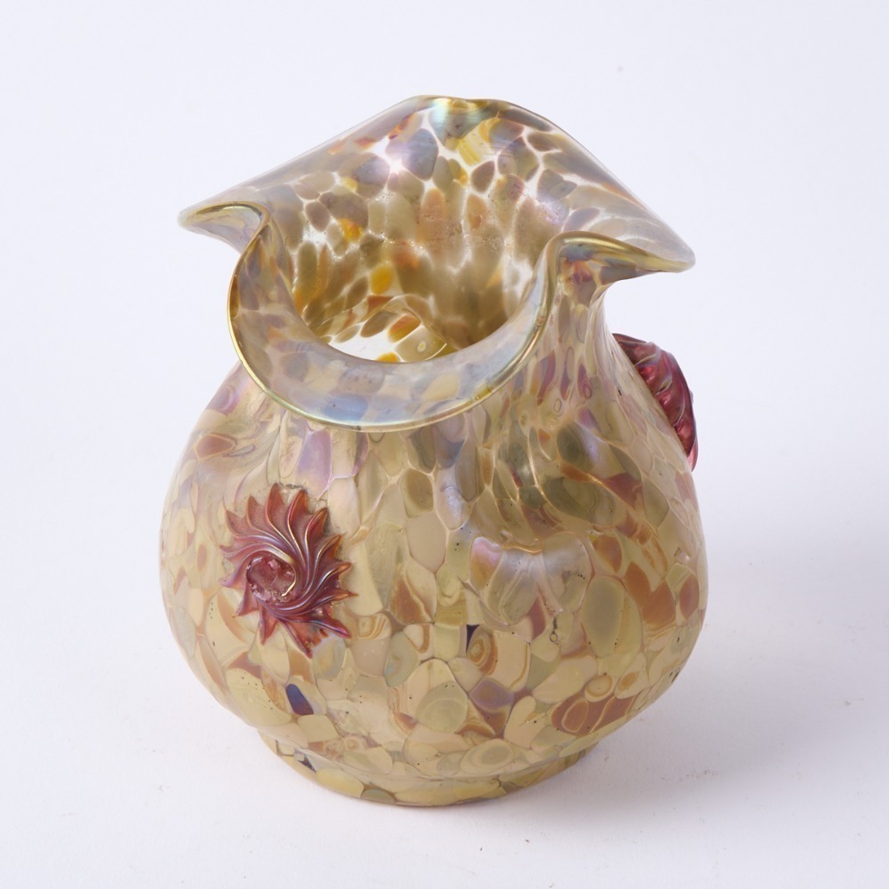 A Mottled Art Glass Vase with Applied Suns